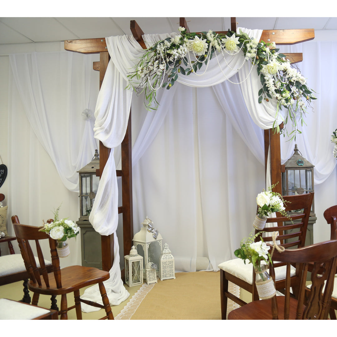 LARGE TIMBER ARBOUR WITH DRAPING AND FLOWERS – Rosy Events Hire